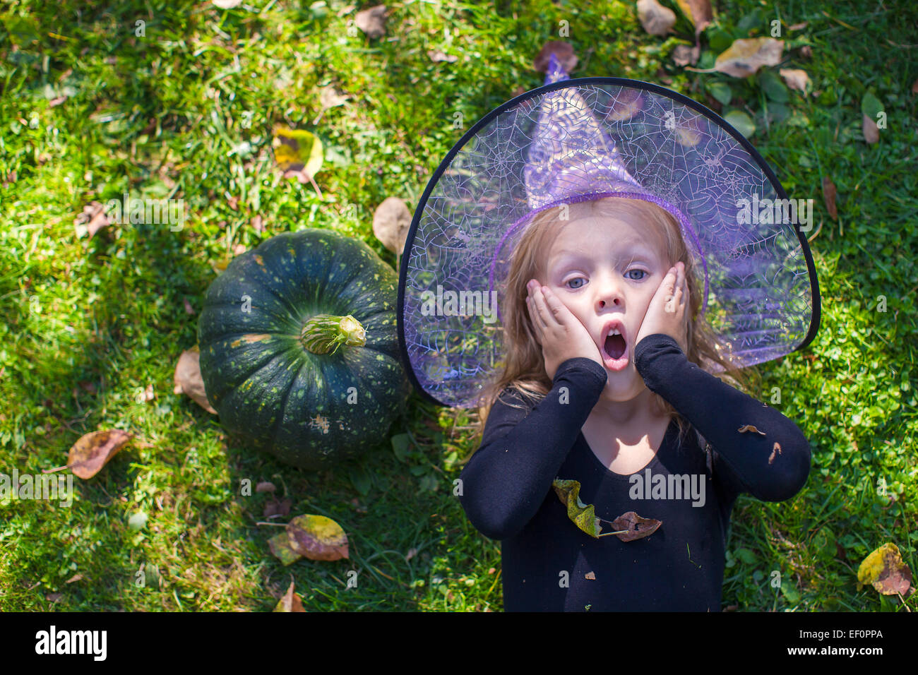 Cute little girl in Halloween which costume have fun outdoor Stock ...