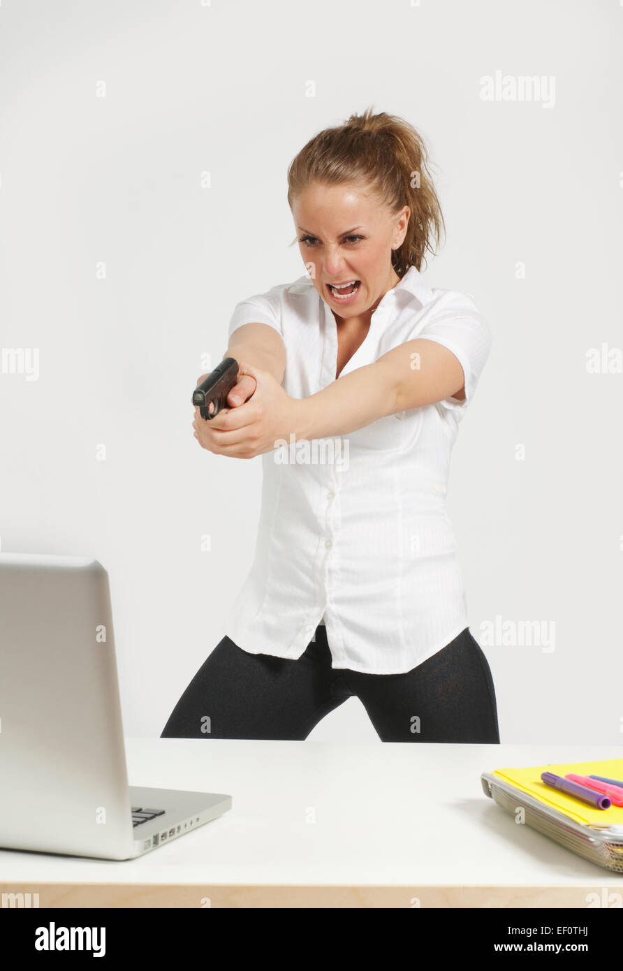 Angered woman pointing gun hi-res stock photography and images - Alamy