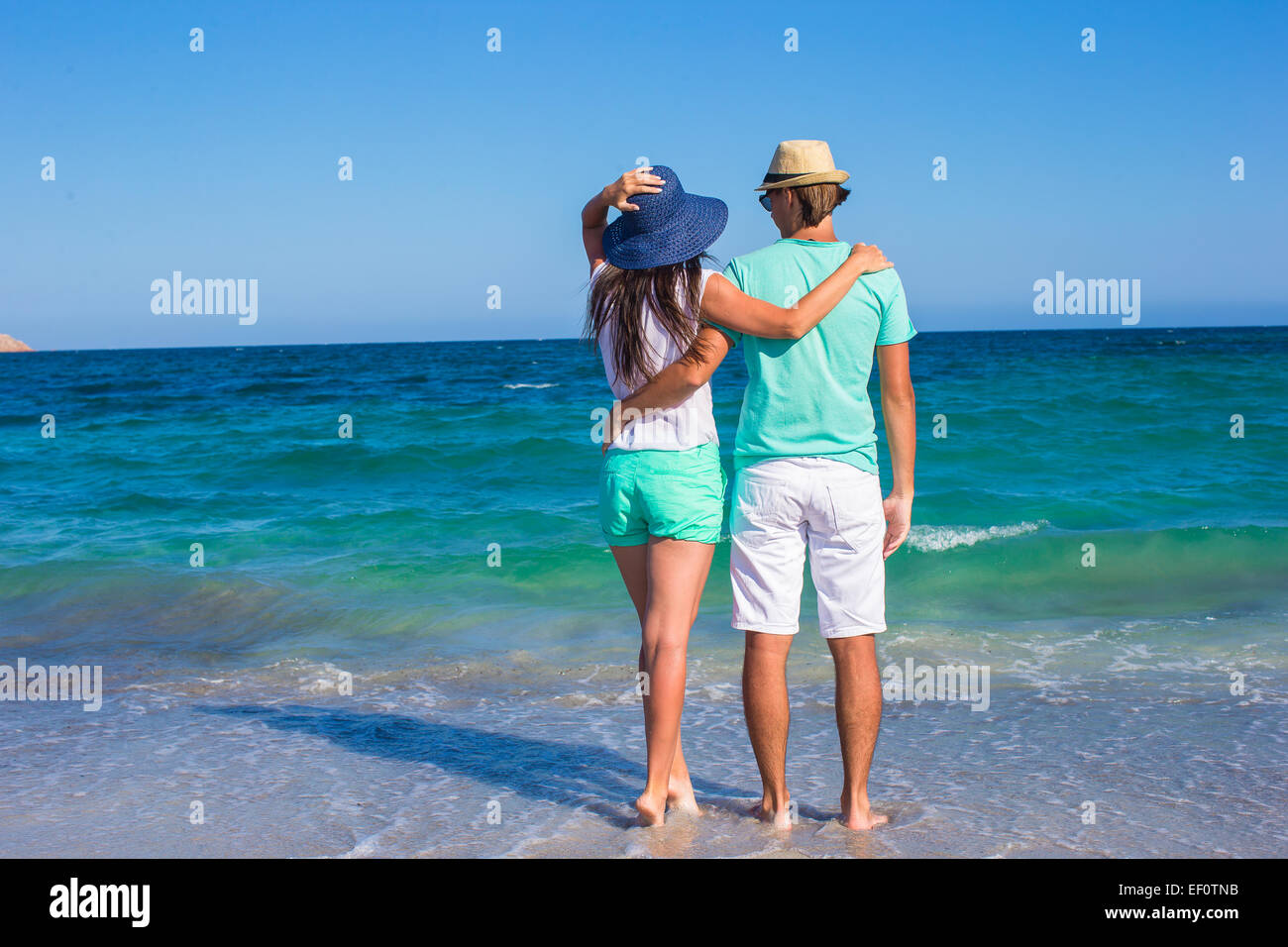 Back view of romantic couple at white beach during tropical vacation Stock Photo - Alamy