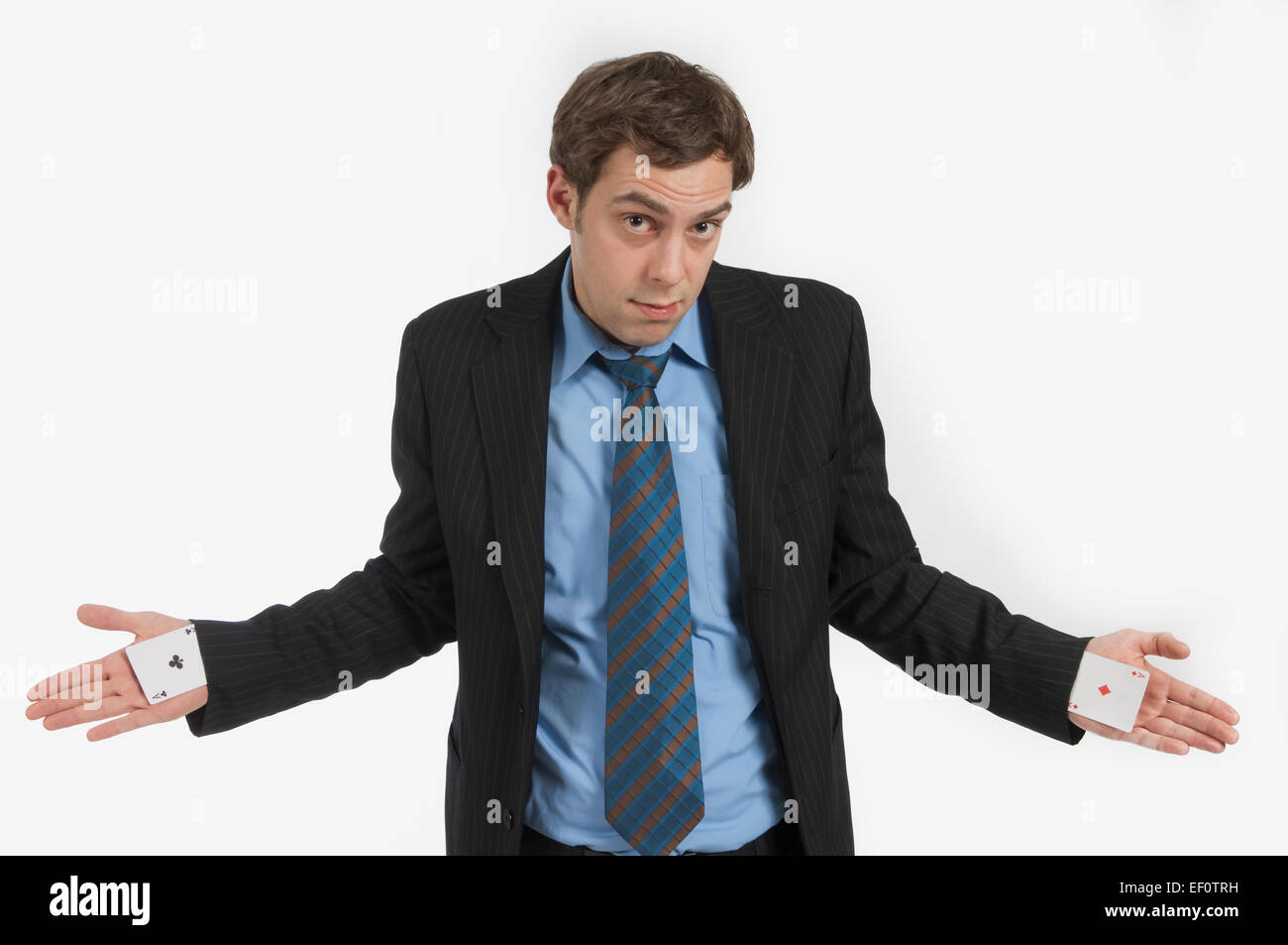 Businessman with cards up his sleeve Stock Photo - Alamy