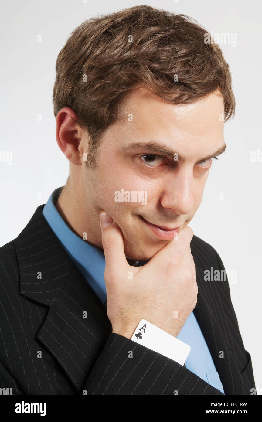 Businessman with a card up his sleeve Stock Photo - Alamy