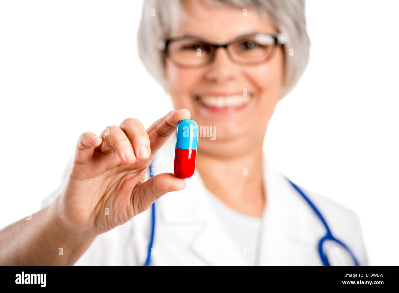 Female doctor holding big pill hi-res stock photography and images - Alamy