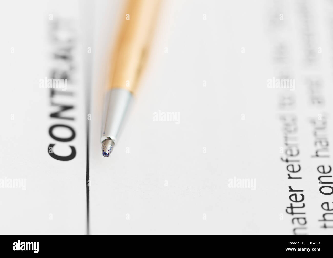 contract and tip of golden pen close up Stock Photo - Alamy