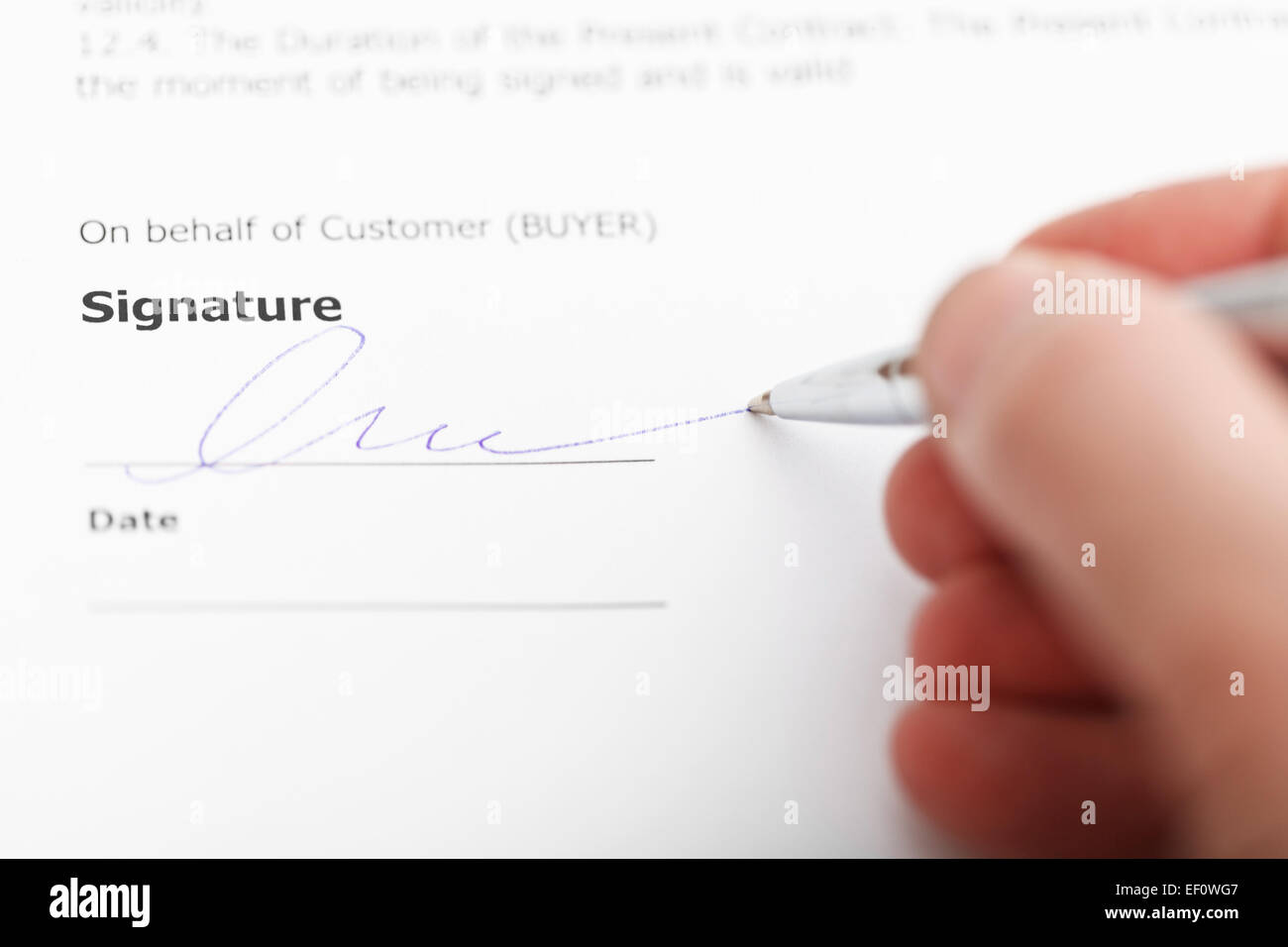 customer signing sales agreement by silver pen close up Stock Photo - Alamy