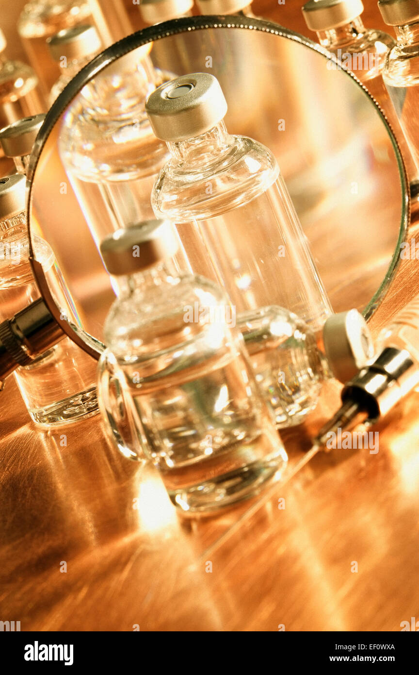 medical viles and syringe magnified Stock Photo - Alamy
