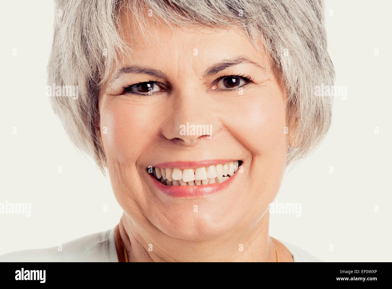 Portrait of a senior woman smiling, isolated on white Stock Photo - Alamy