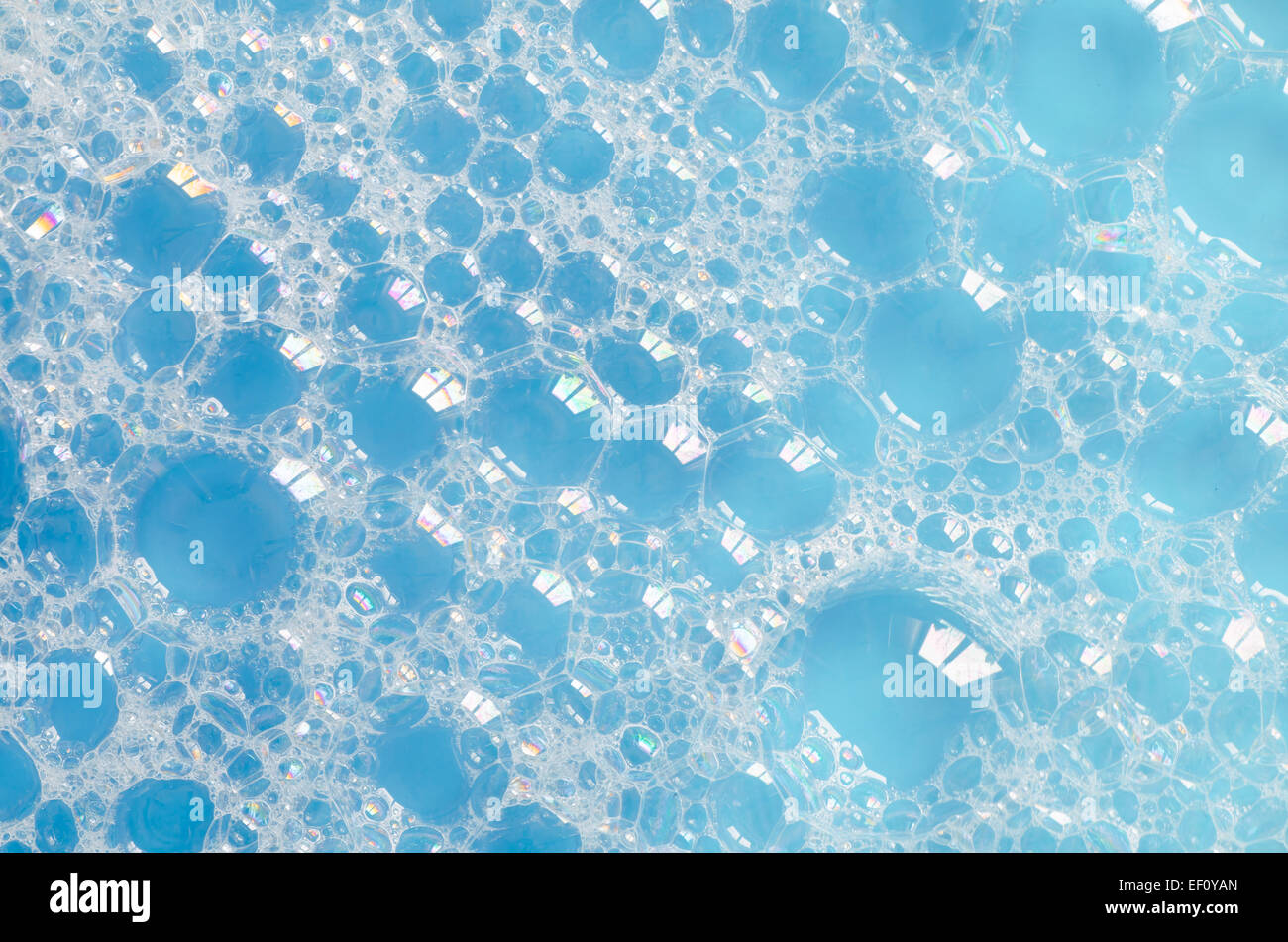 foam bubbles on blue water background Stock Photo - Alamy