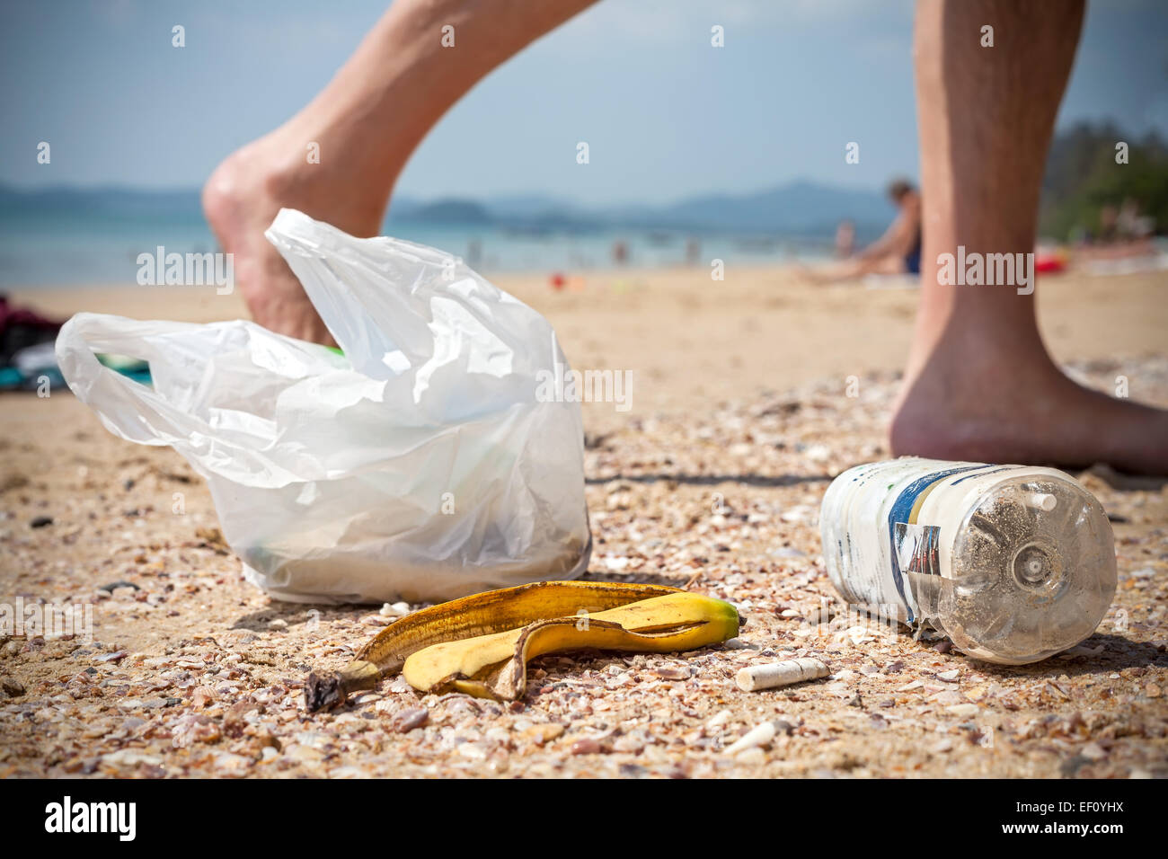 Garbage on a beach left by tourists, environmental pollution concept ...