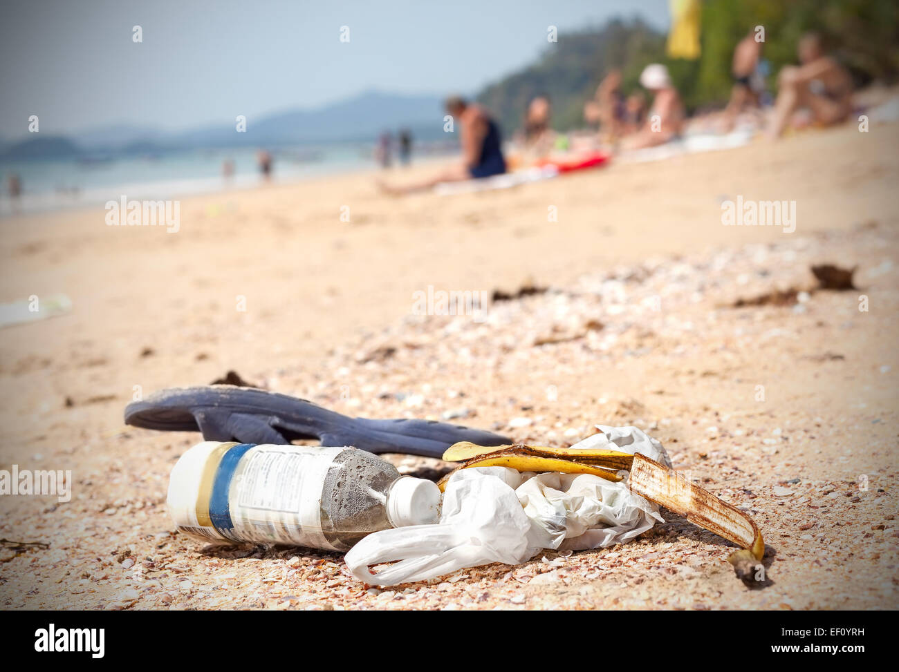 Garbage on a beach left by tourists, environmental pollution concept ...