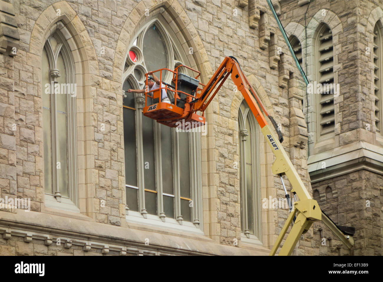 man painting church windows Stock Photo - Alamy