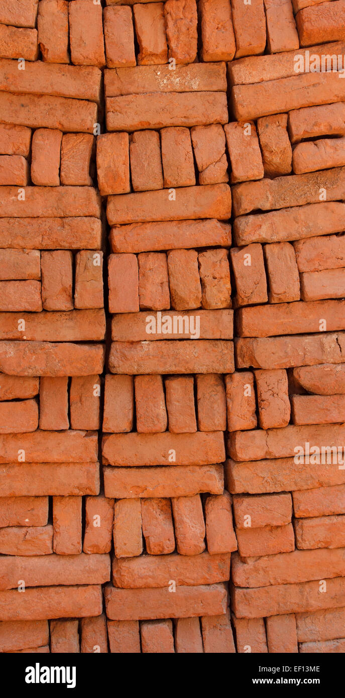 Supply of stacked orange bricks in a fixed pattern Stock Photo - Alamy