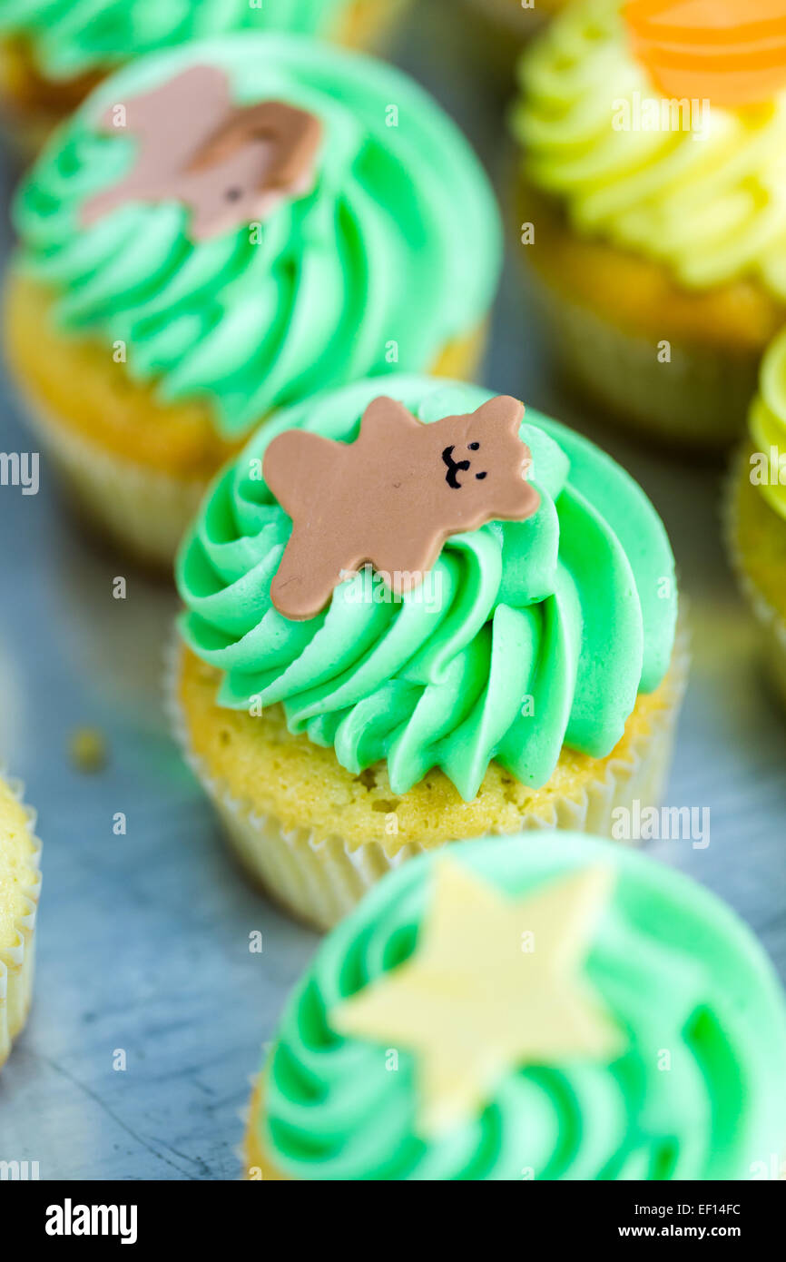Making multicolor cupcakes for kids birthday party Stock Photo - Alamy
