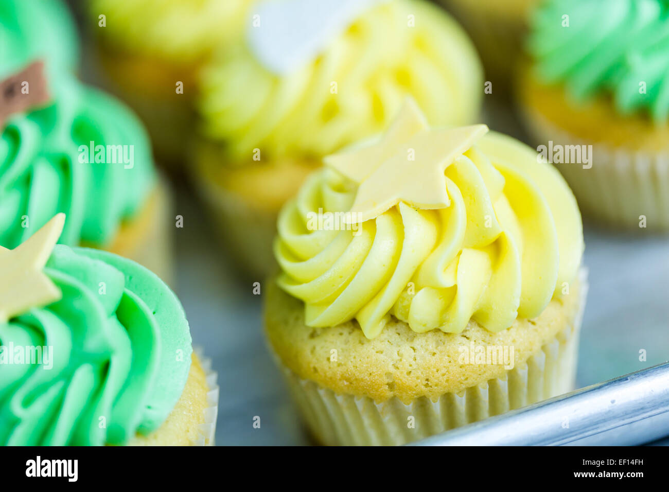 Making multicolor cupcakes for kids birthday party Stock Photo - Alamy