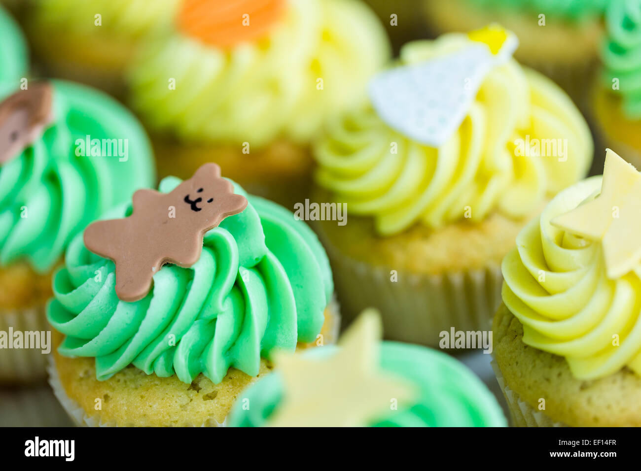 Making multicolor cupcakes for kids birthday party Stock Photo - Alamy