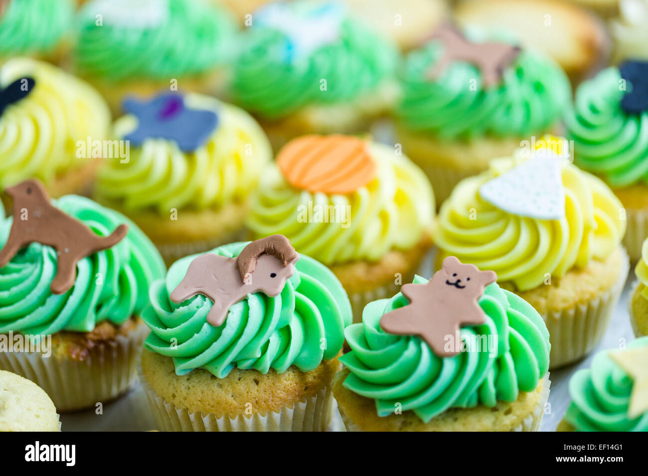 Making multicolor cupcakes for kids birthday party Stock Photo - Alamy