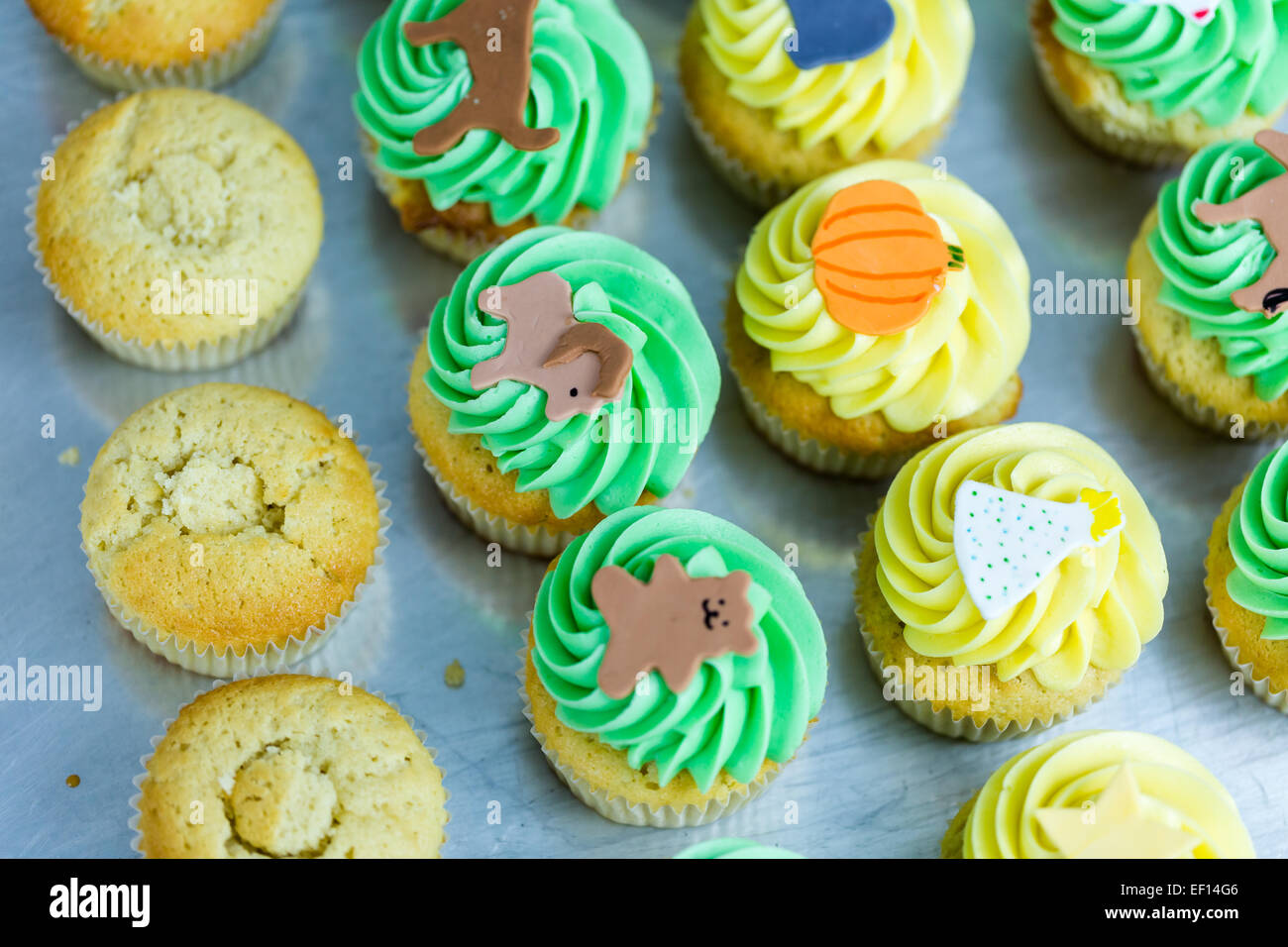 Making multicolor cupcakes for kids birthday party Stock Photo - Alamy