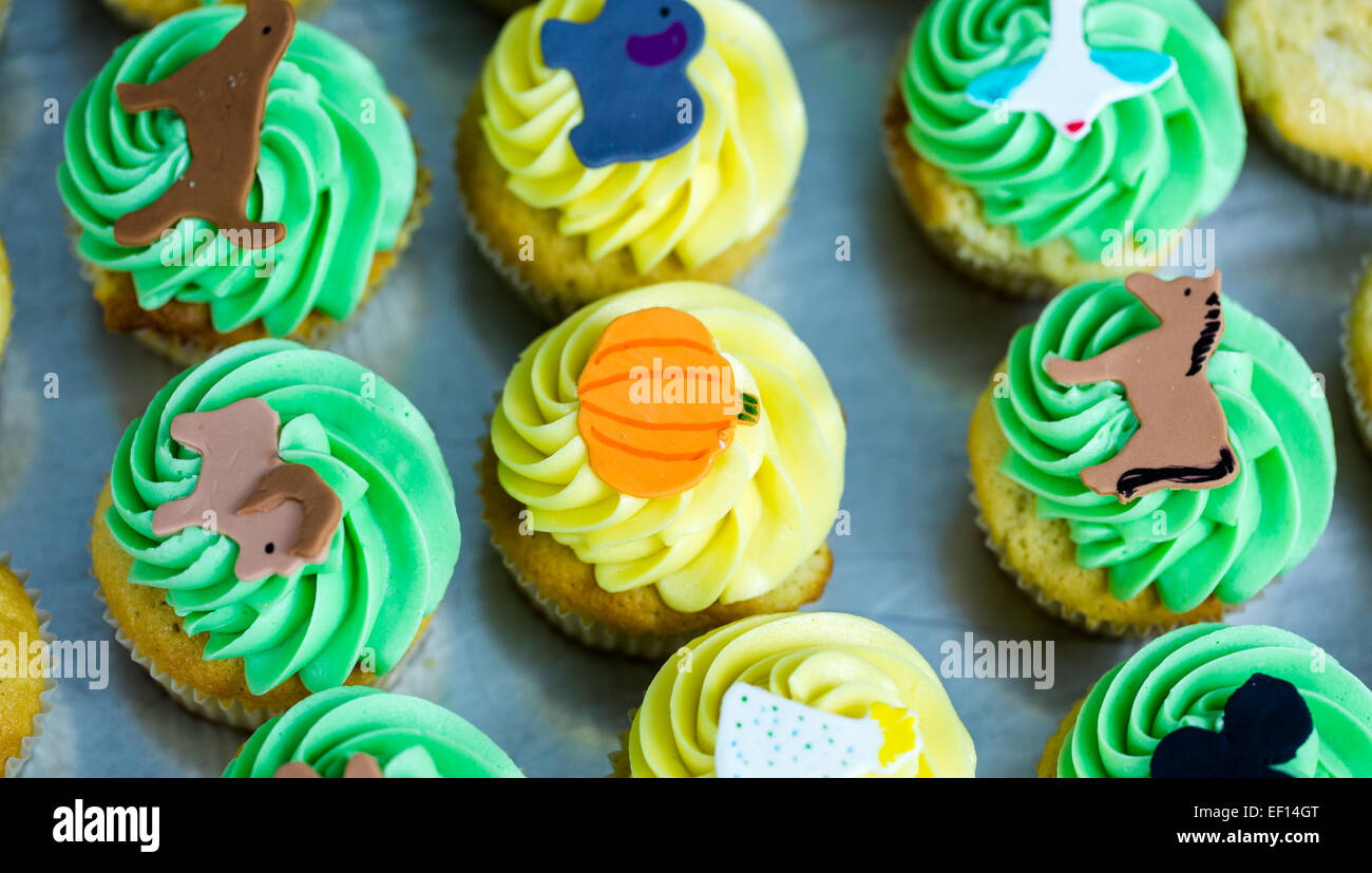 Making multicolor cupcakes for kids birthday party Stock Photo - Alamy