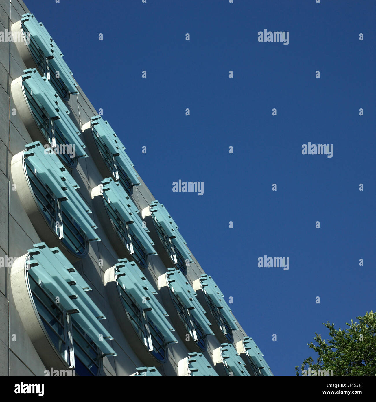 Modern circular windows on concrete structure Stock Photo - Alamy