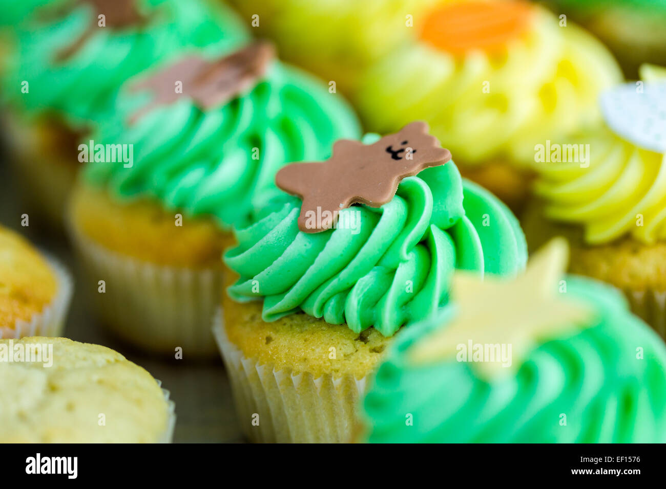 Making multicolor cupcakes for kids birthday party Stock Photo - Alamy