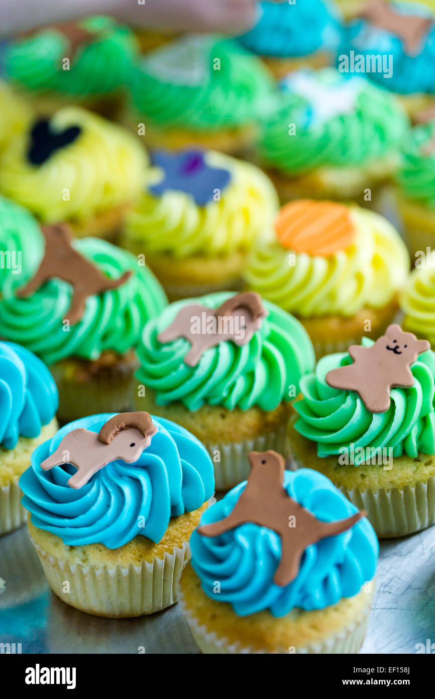 Making multicolor cupcakes for kids birthday party Stock Photo - Alamy