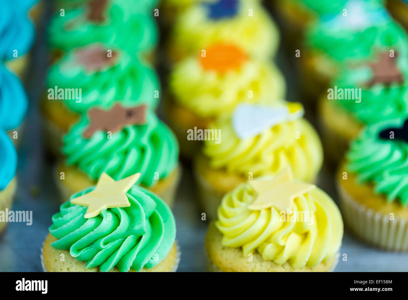 Making multicolor cupcakes for kids birthday party Stock Photo - Alamy