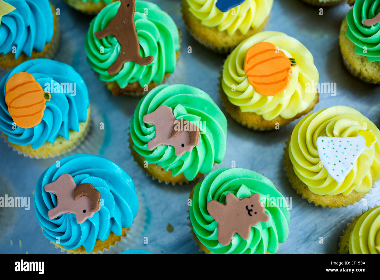 Making multicolor cupcakes for kids birthday party Stock Photo - Alamy
