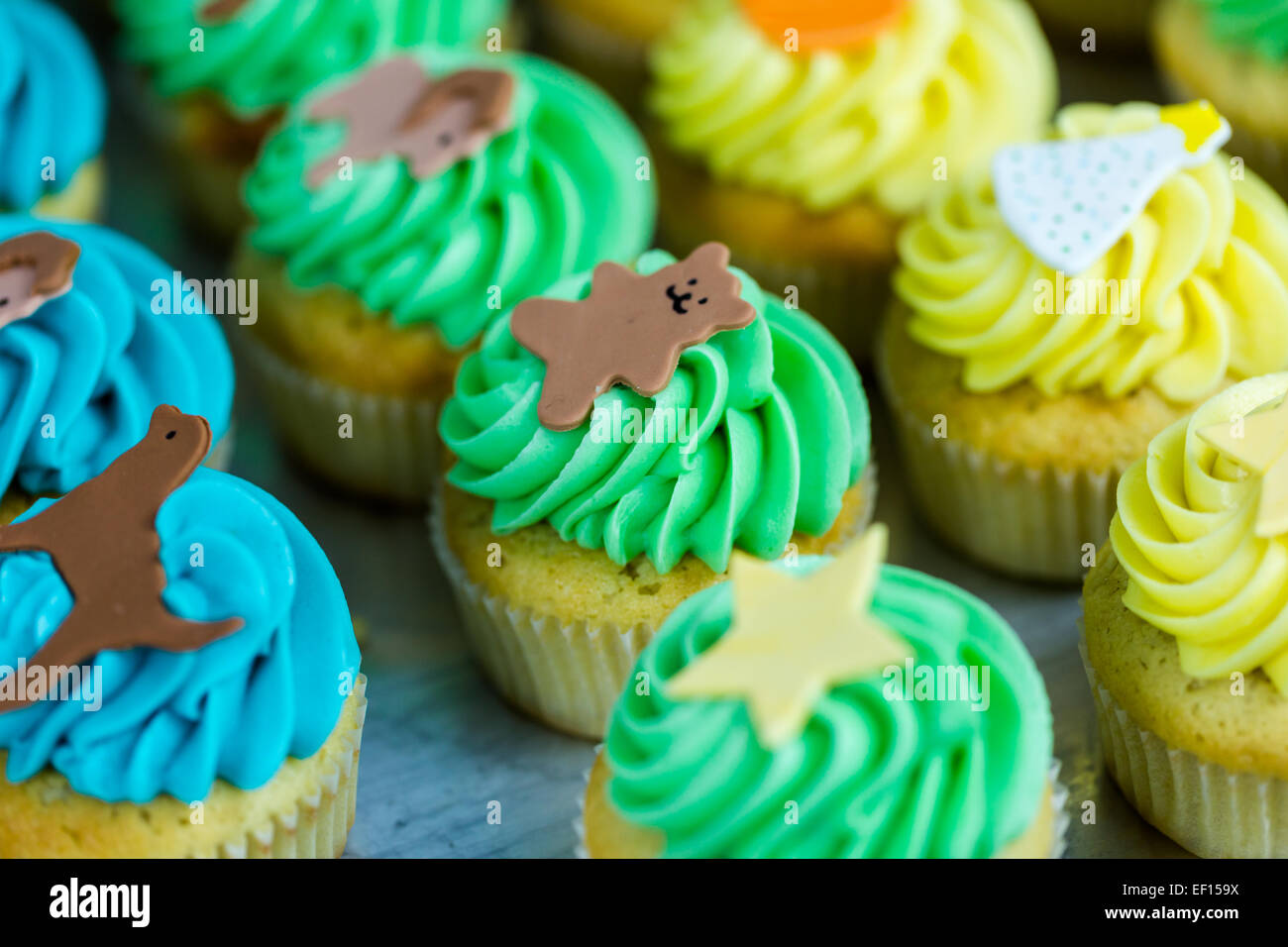Making multicolor cupcakes for kids birthday party Stock Photo - Alamy