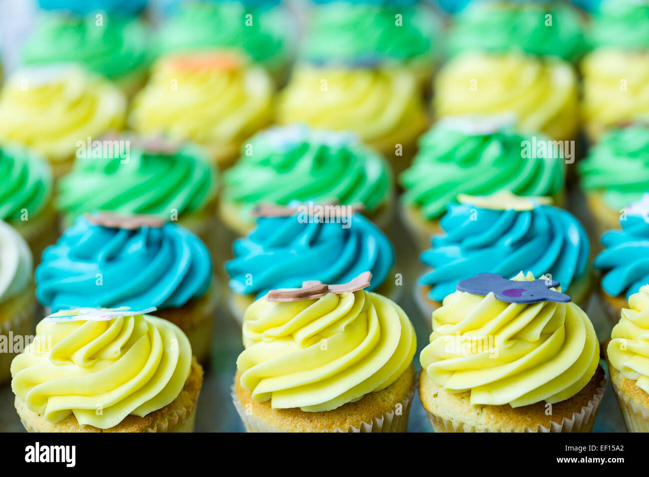 Making multicolor cupcakes for kids birthday party Stock Photo - Alamy