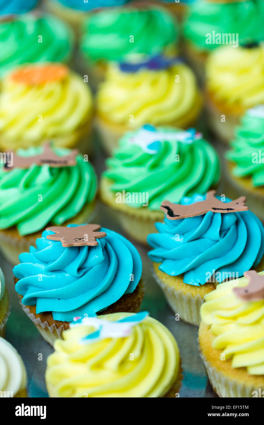 Making multicolor cupcakes for kids birthday party Stock Photo - Alamy