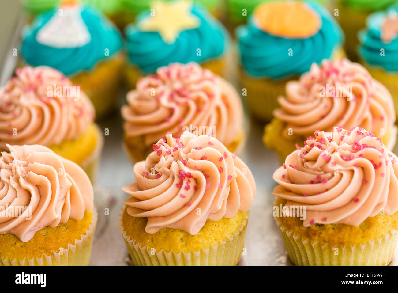 Making multicolor cupcakes for kids birthday party Stock Photo - Alamy