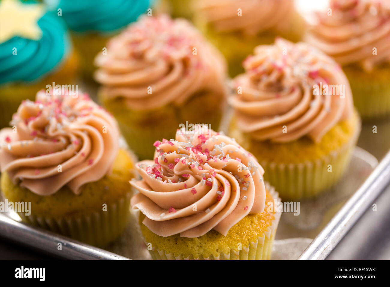 Making multicolor cupcakes for kids birthday party Stock Photo - Alamy