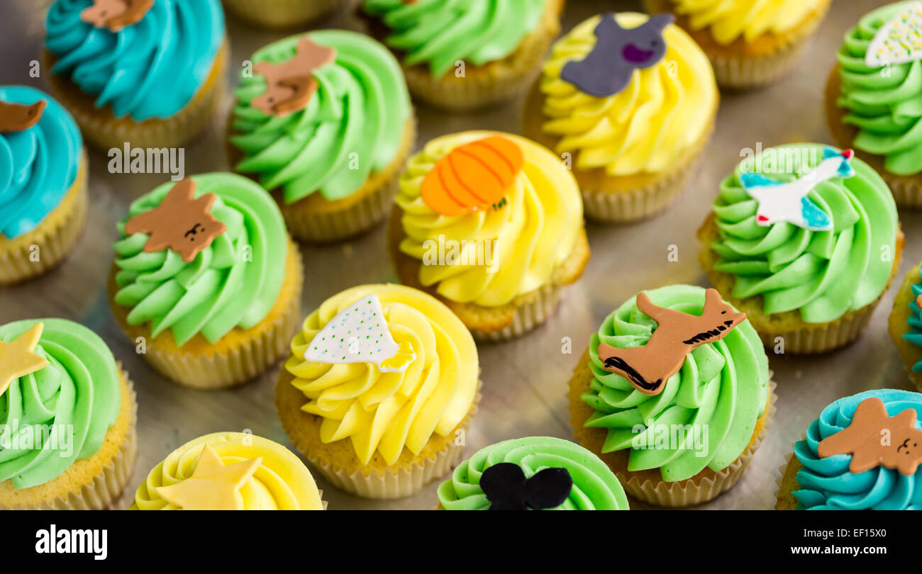 Making multicolor cupcakes for kids birthday party Stock Photo - Alamy