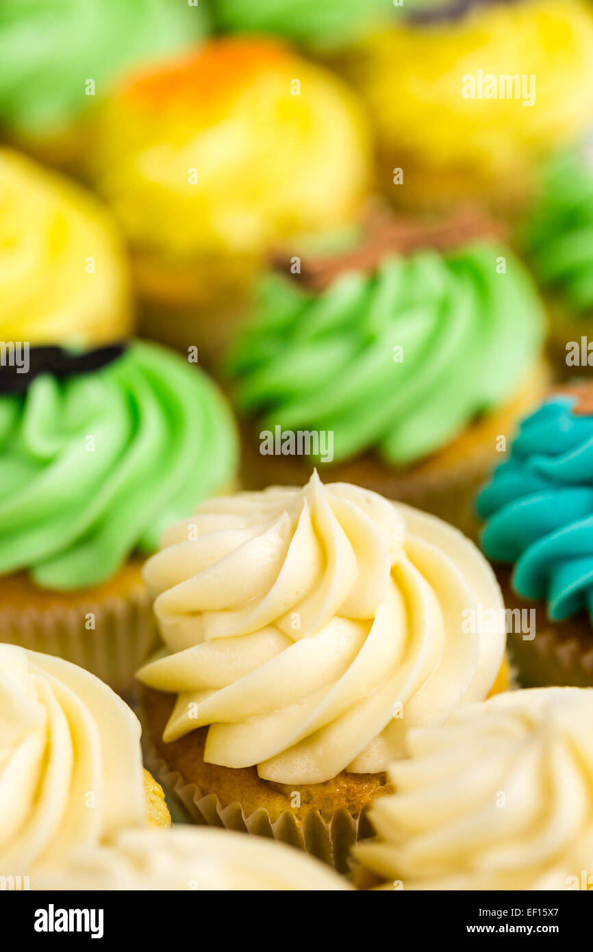 Making multicolor cupcakes for kids birthday party Stock Photo - Alamy