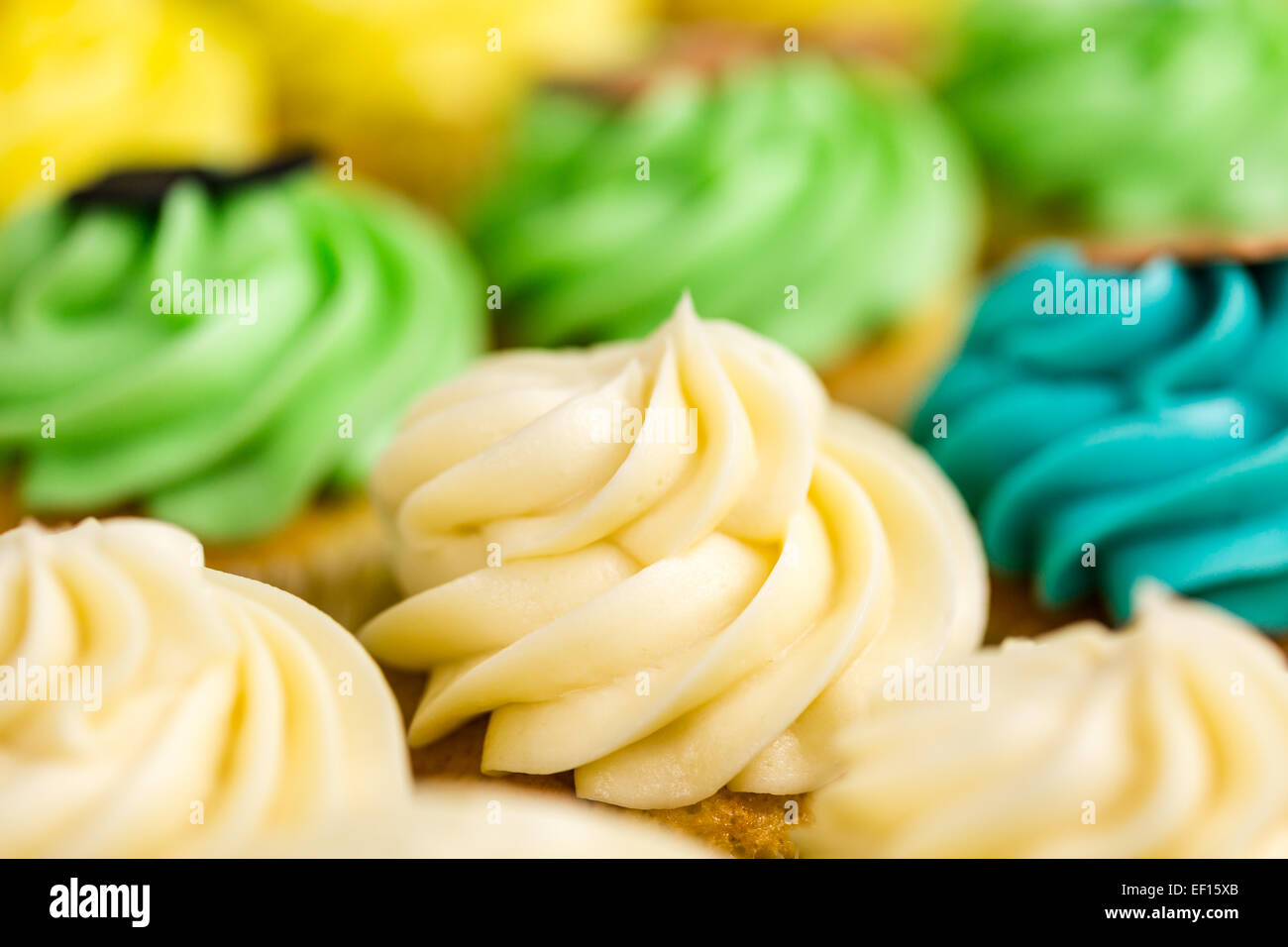 Making multicolor cupcakes for kids birthday party Stock Photo - Alamy