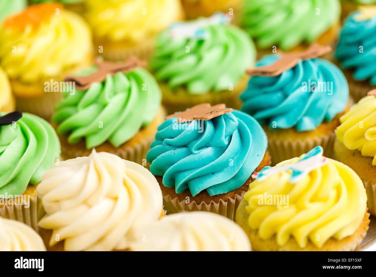Making multicolor cupcakes for kids birthday party Stock Photo - Alamy