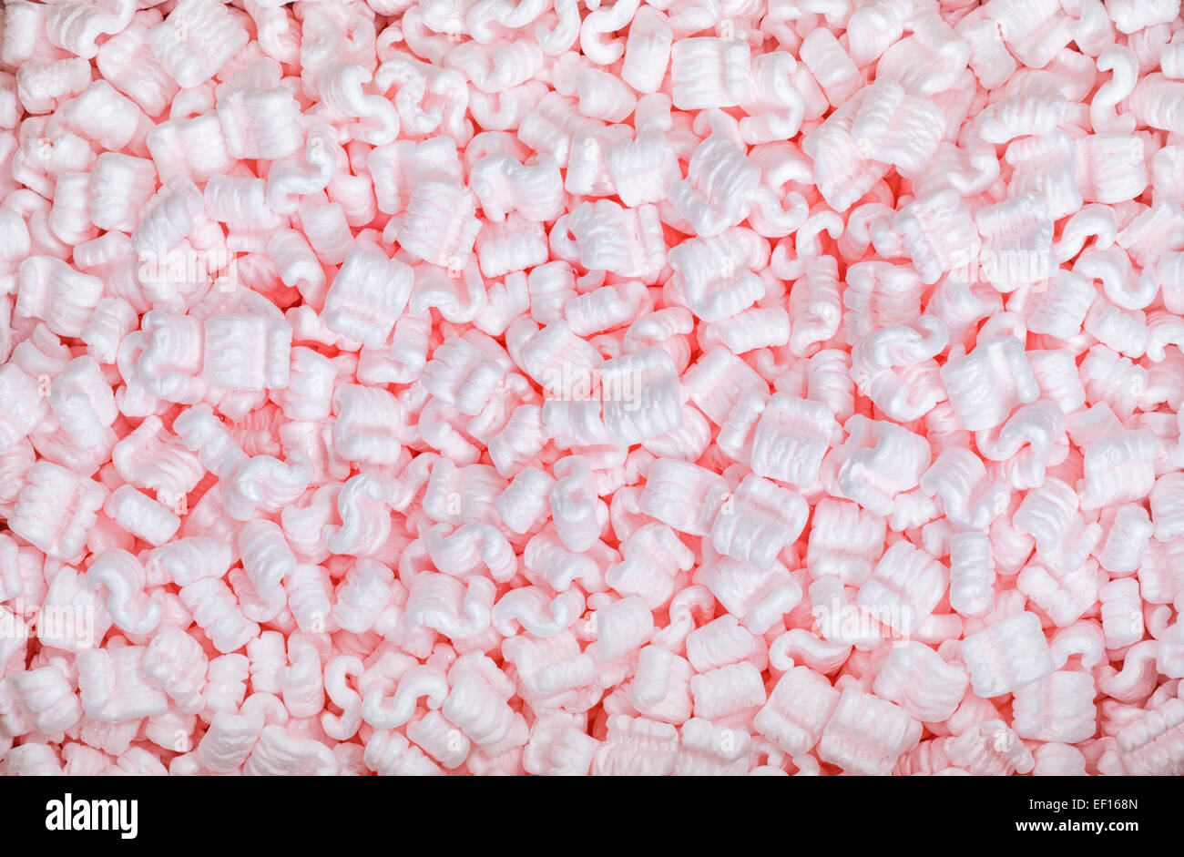 Pink packaging peanuts background Stock Photo - Alamy