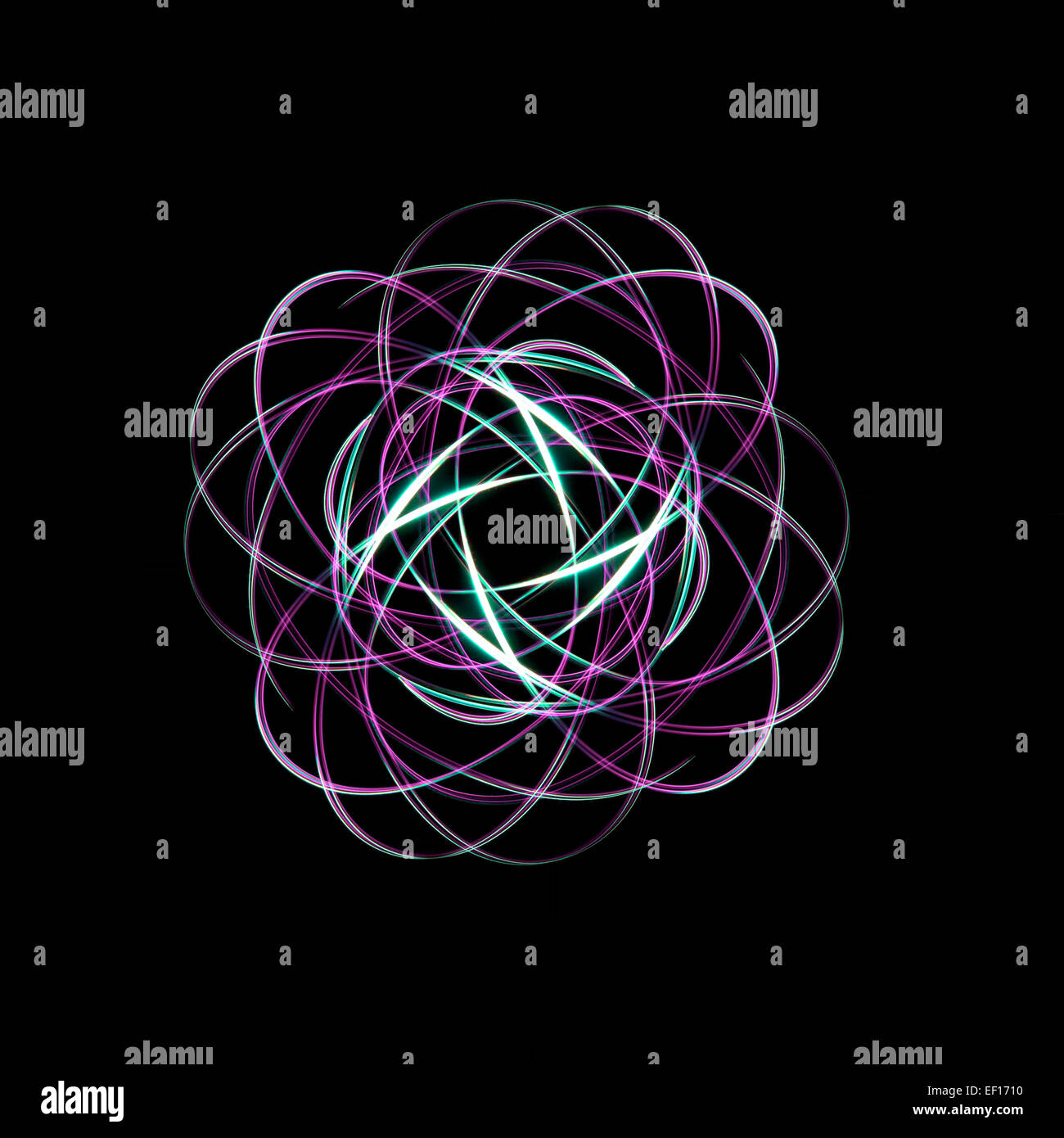 Abstract light patterns in a symmetrical pattern against a black ...