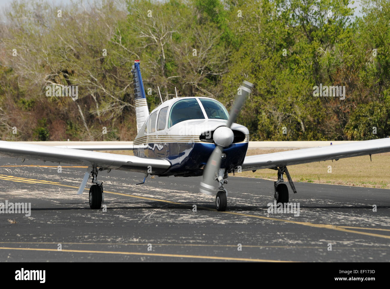 Light private propeller airplane taxiing on the ground Stock Photo - Alamy