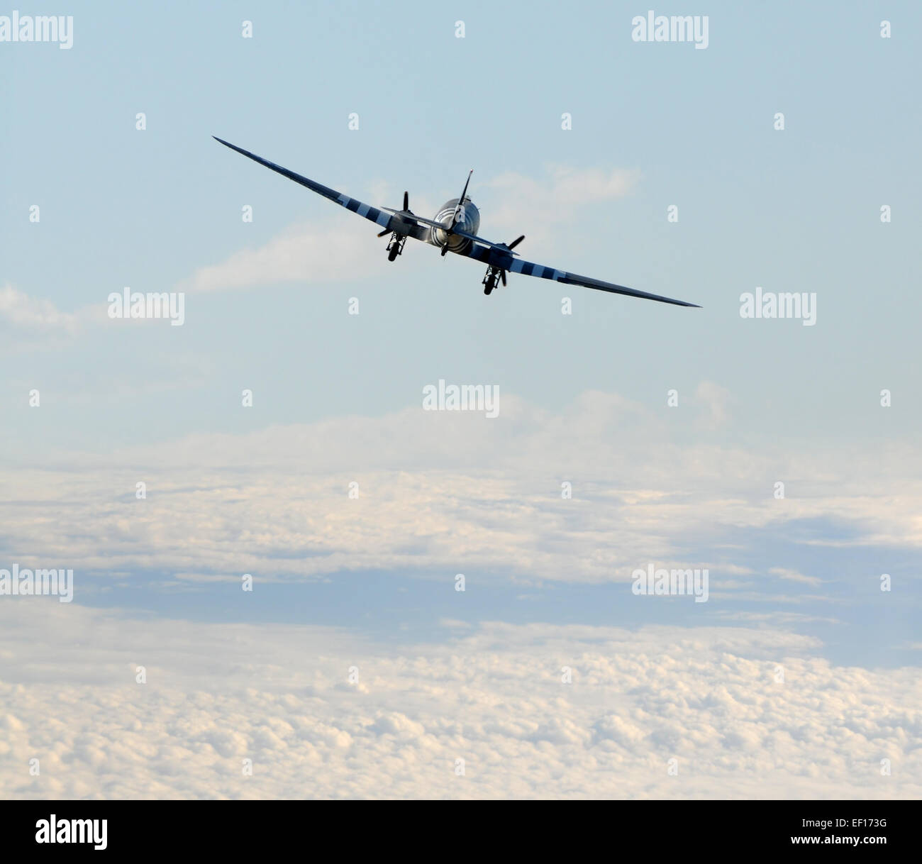 Propeller airplane high above the clouds rear view Stock Photo - Alamy