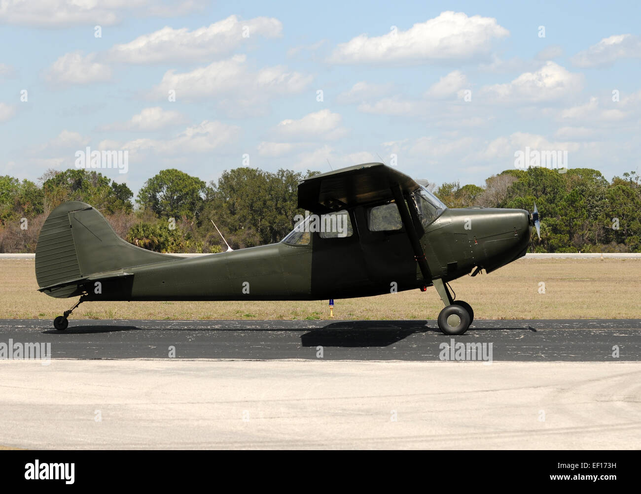 Retro propeller airplane painted green side view Stock Photo - Alamy