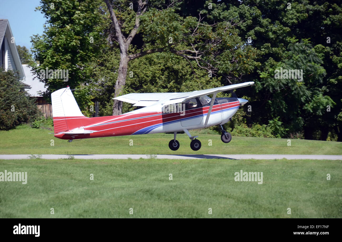 Light private airplane taking off side view Stock Photo - Alamy