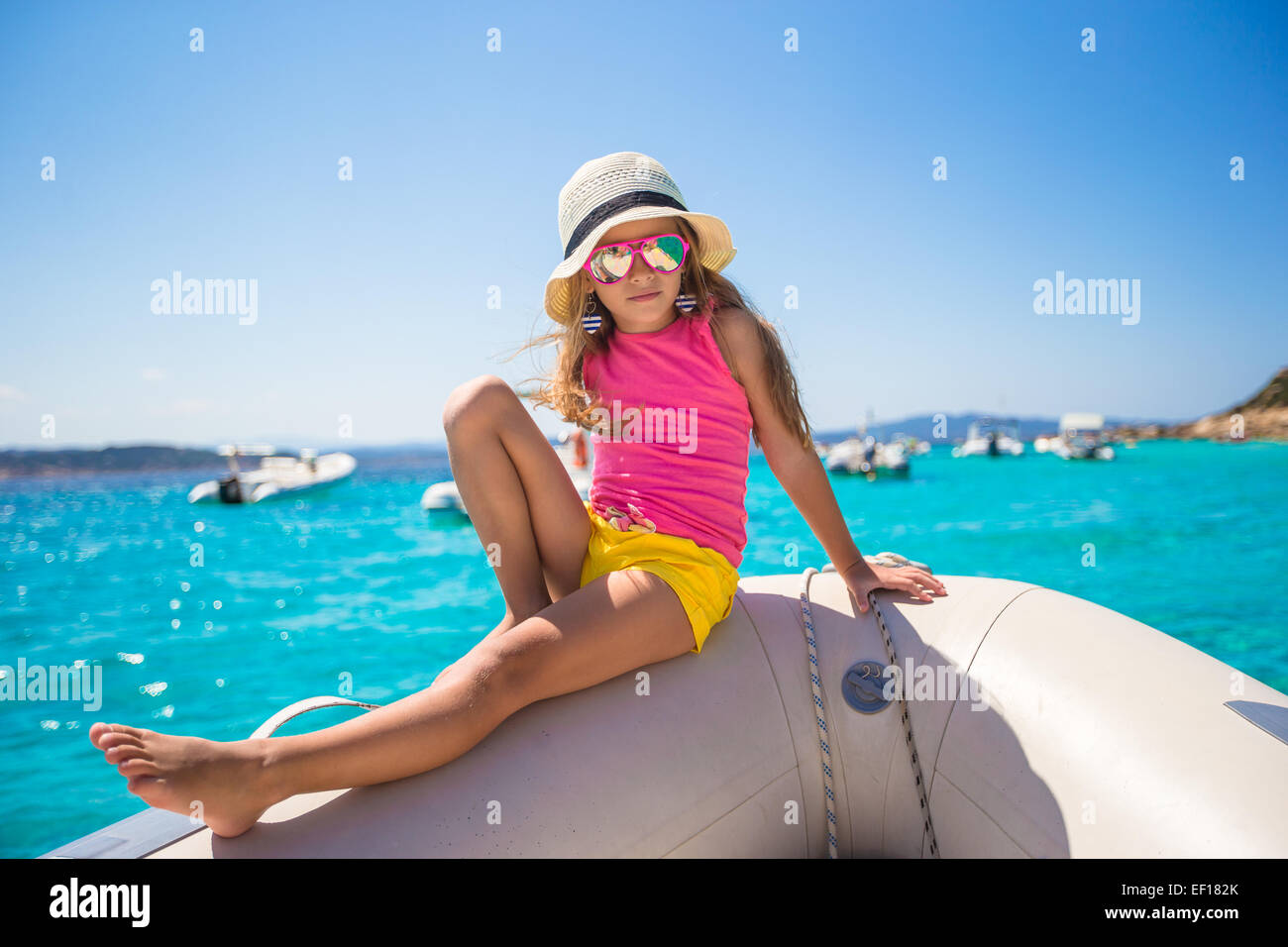 Cute little girl enjoying sailing on boat in the open sea Stock Photo ...