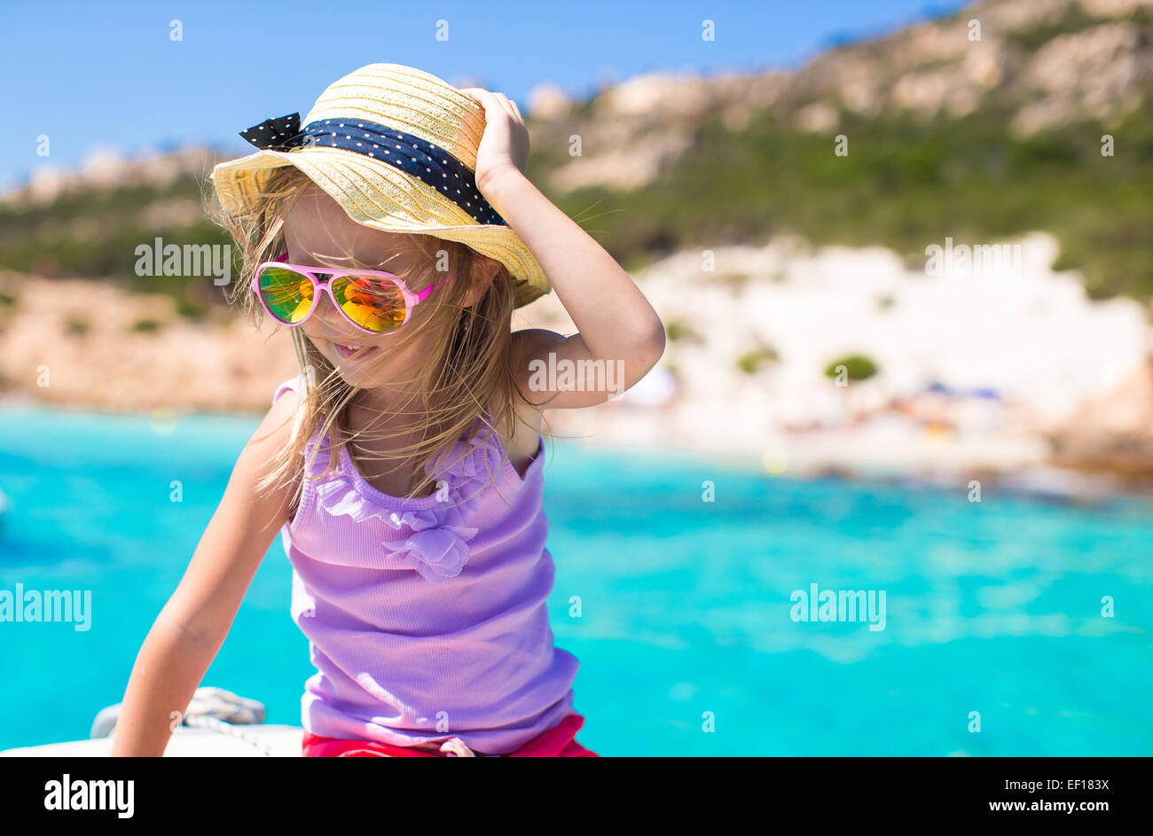 Cute little girl enjoying sailing on boat in the open sea Stock Photo ...