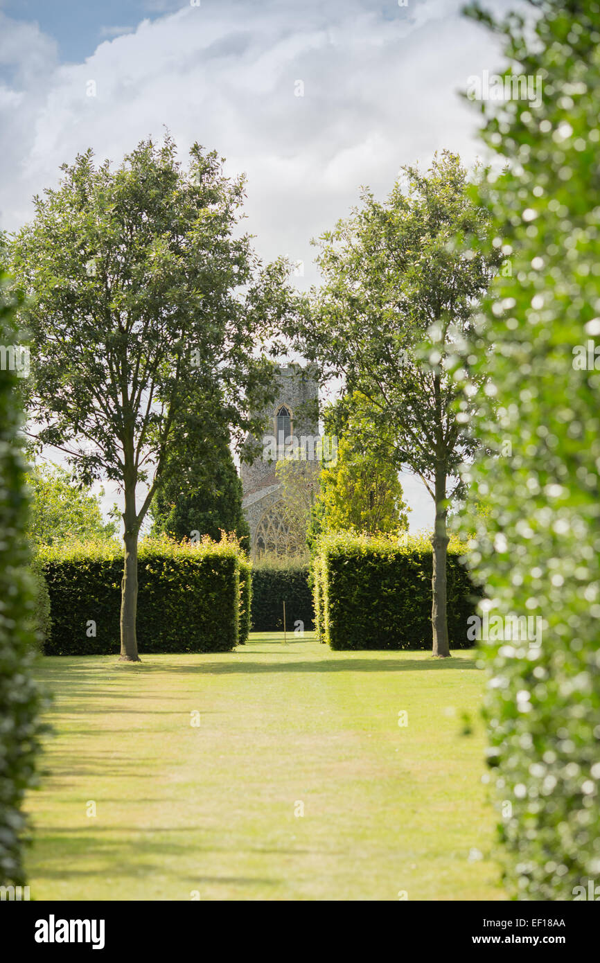 East Ruston church seen through a gap in the trees at East Ruston Old ...