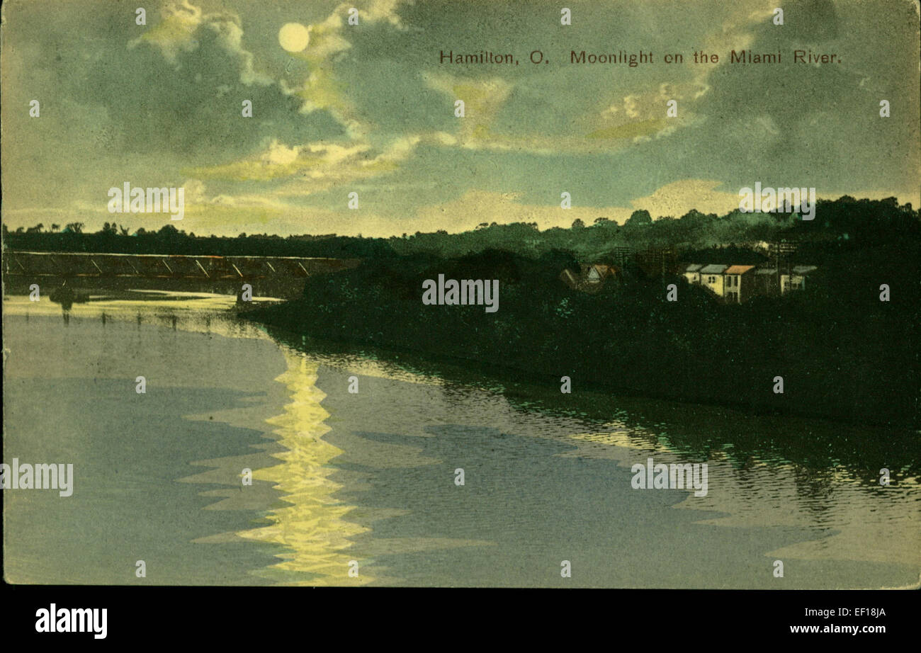 A tranquil view of the Miami River illuminated by moonlight. This scene ...