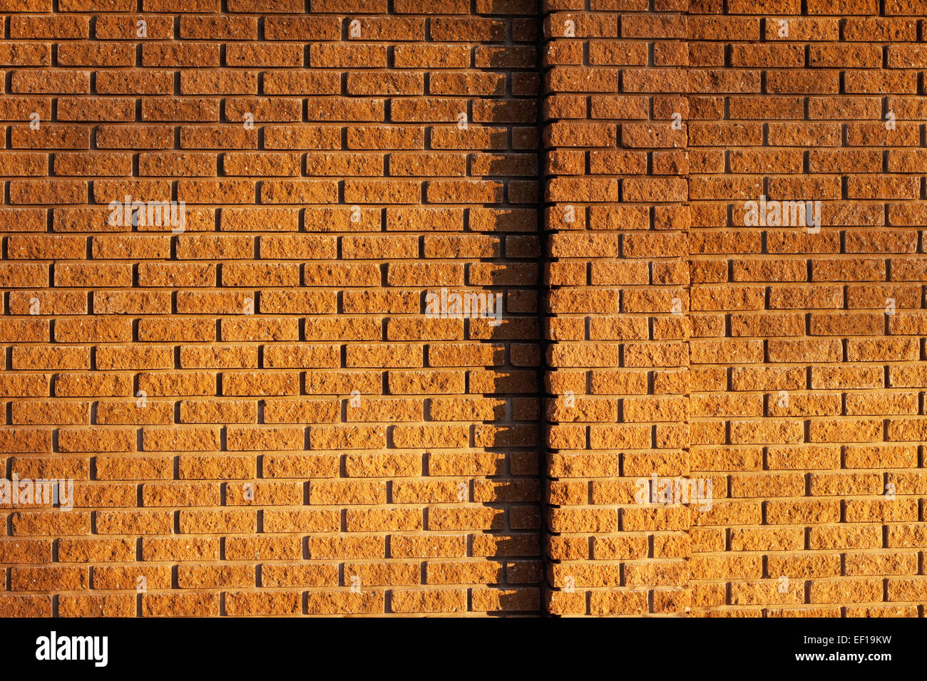 External brick wall with a stripe Stock Photo - Alamy