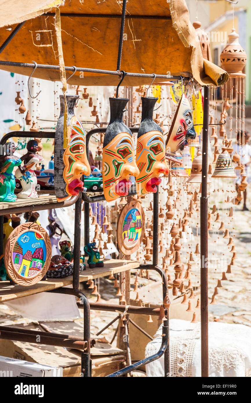 Typical brightly coloured traditional face masks and other local crafts ...