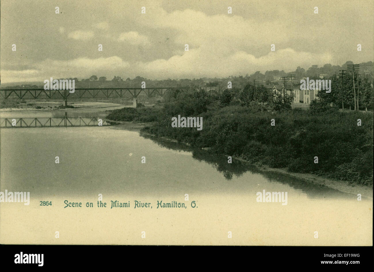 This photograph captures a serene view of the Miami River, offering ...