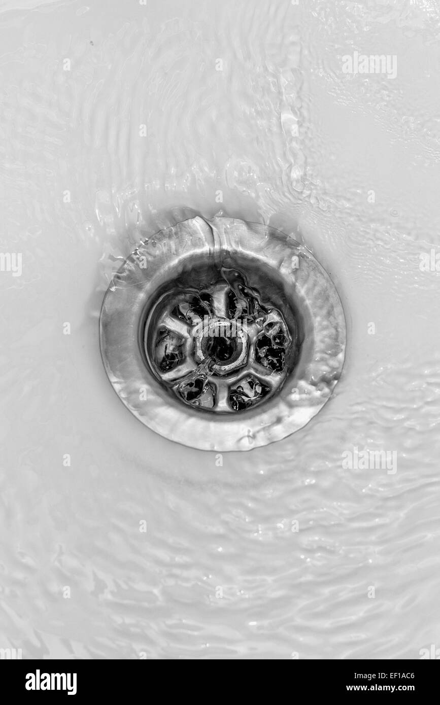 Water flowing into drain Black and White Stock Photos & Images - Alamy
