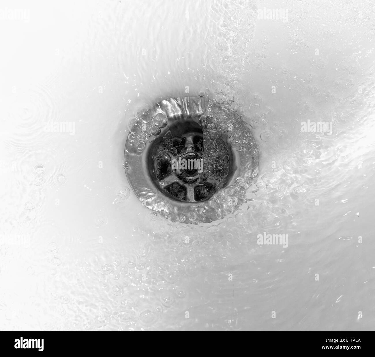 Water flowing into drain Black and White Stock Photos & Images - Alamy